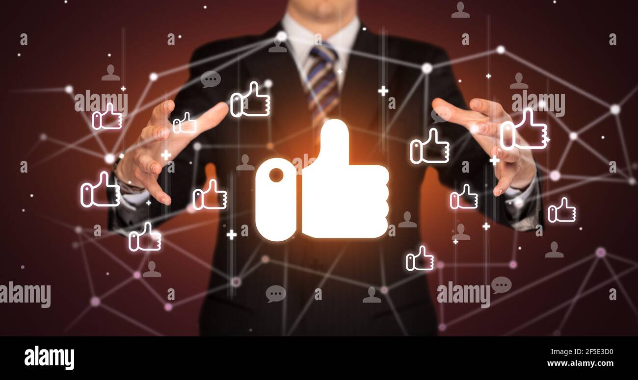 Hand holding social media icons Stock Photo - Alamy