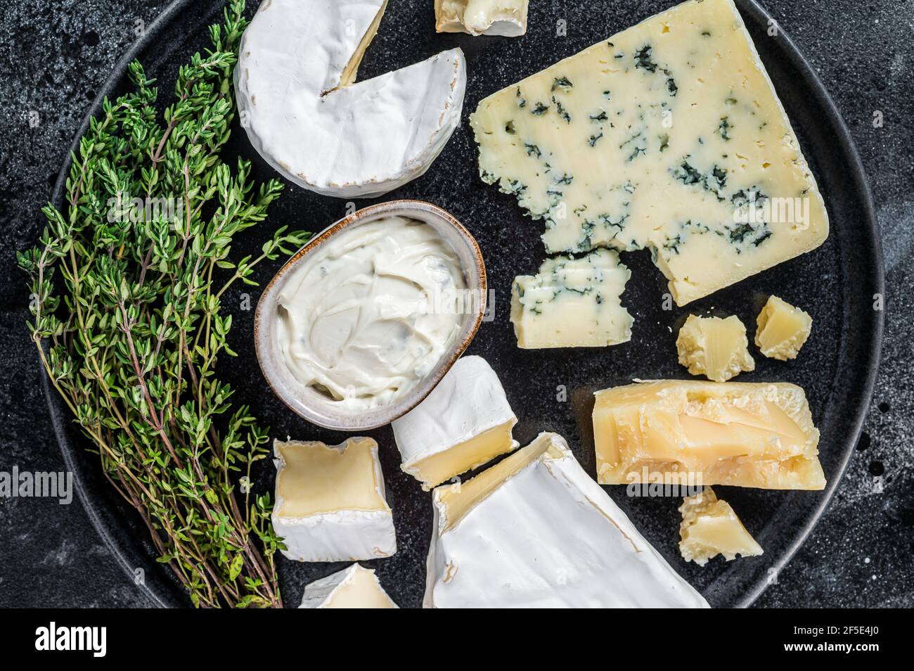 French Cheese plate. Camembert, Brie, Gorgonzola and blue cream cheese ...