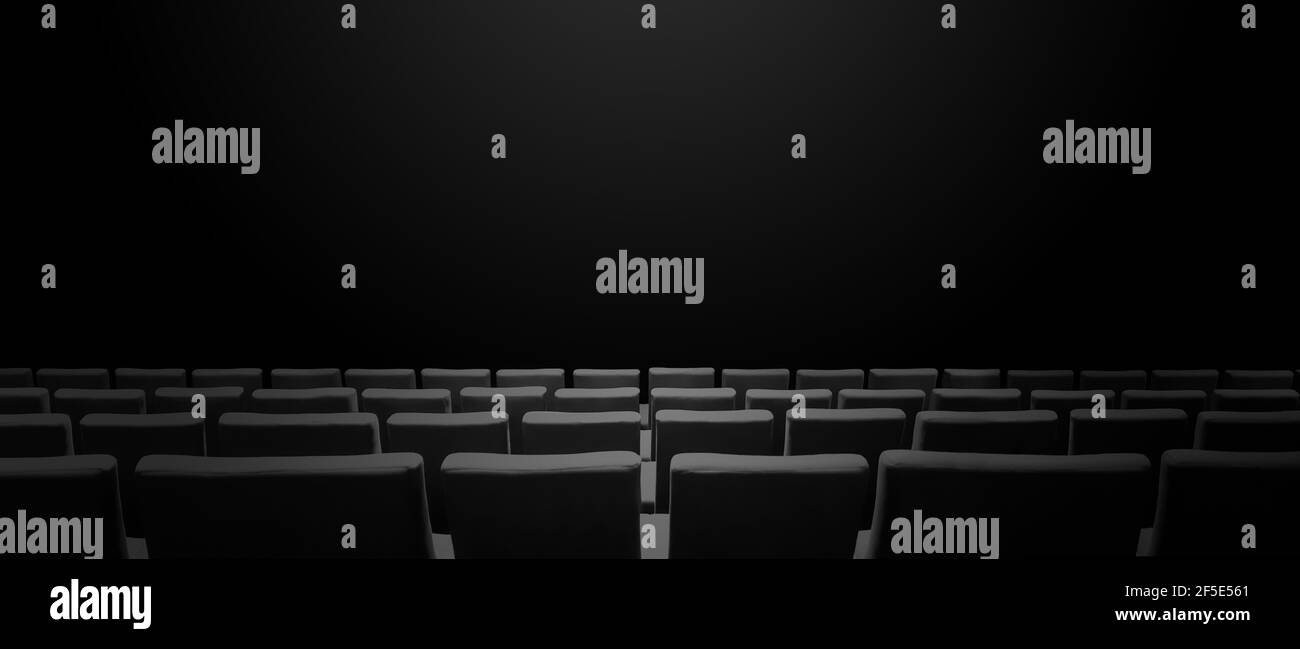 Cinema movie theatre with seats rows and a black copy space background ...