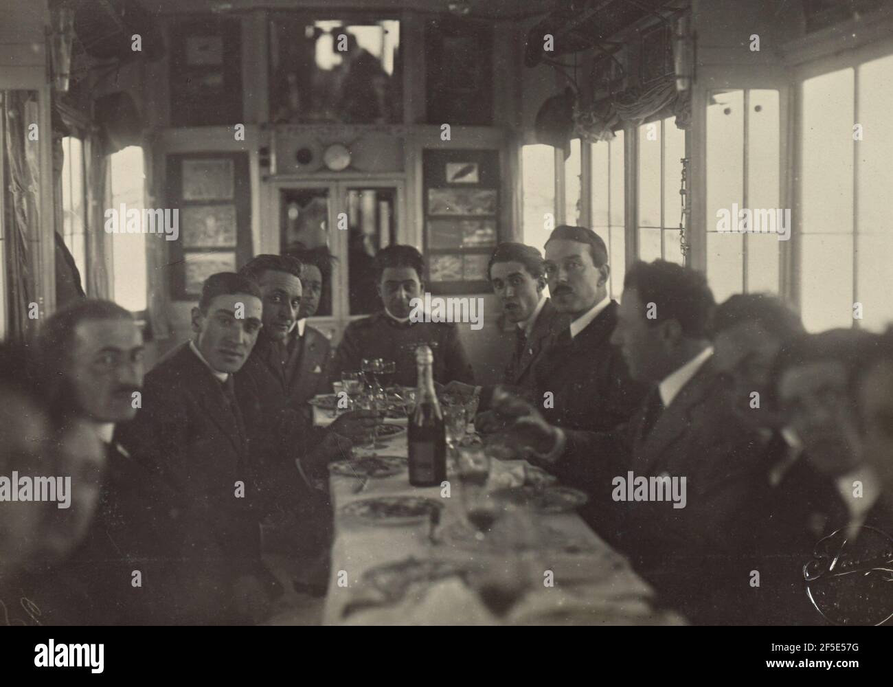 Men seated around a table. Fédèle Azari (Italian, 1895 - 1930 Stock ...