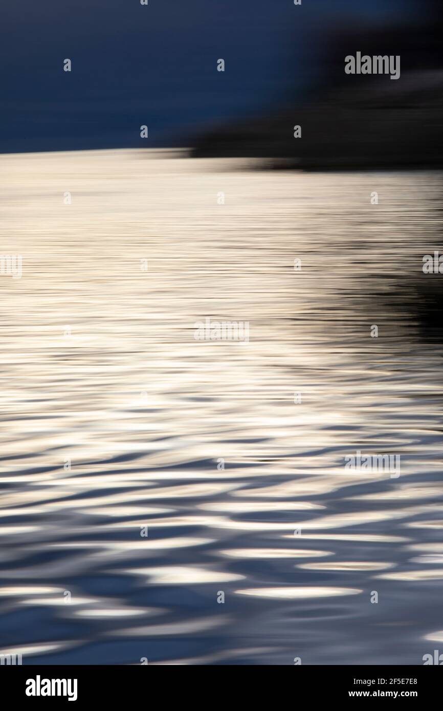 Vivid lights of the lake sunset with long exposure effect Stock Photo ...