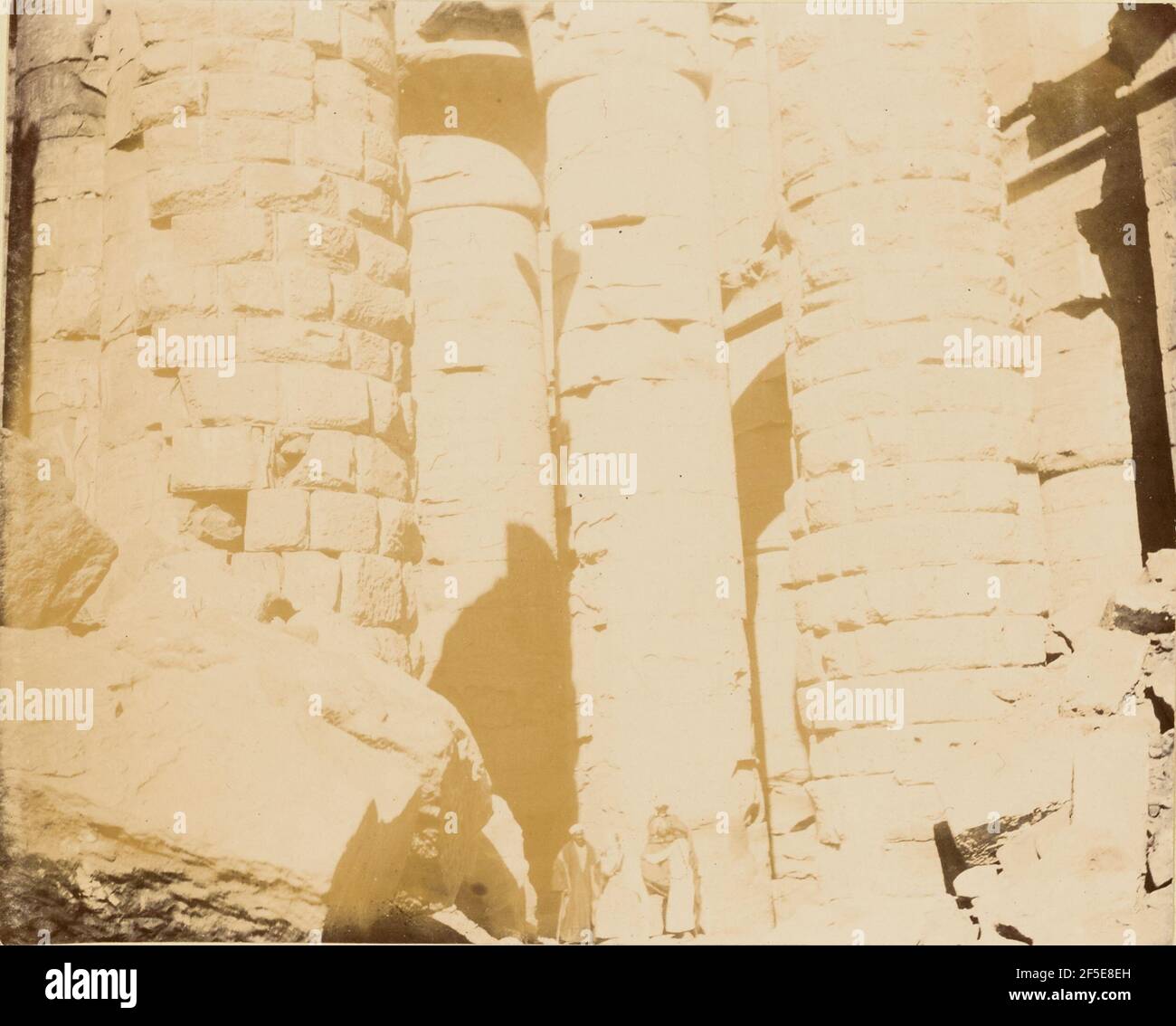 Men in front of ruins. Unknown Stock Photo - Alamy