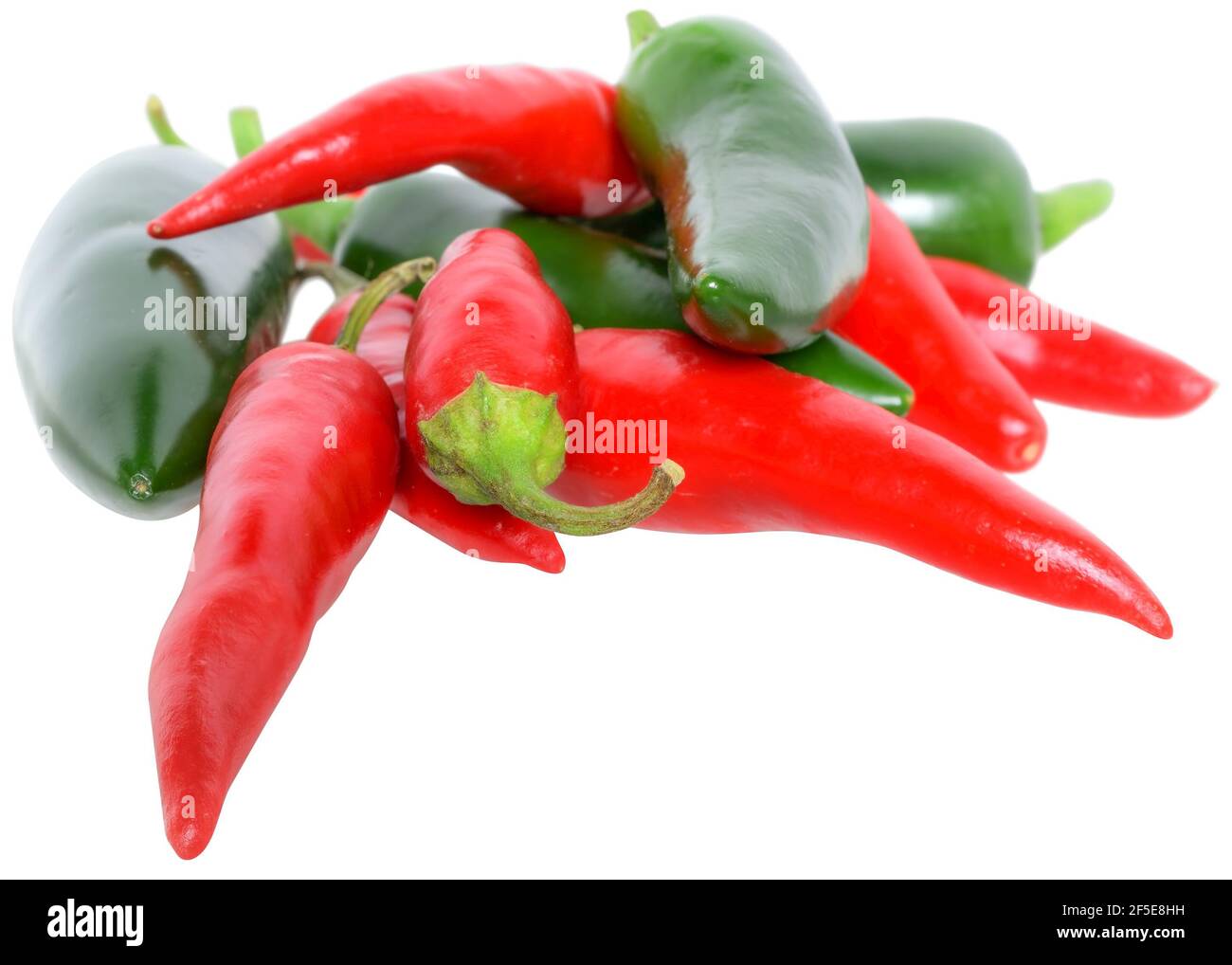 Red and green hot chili peppers stack isolated on a white background ...
