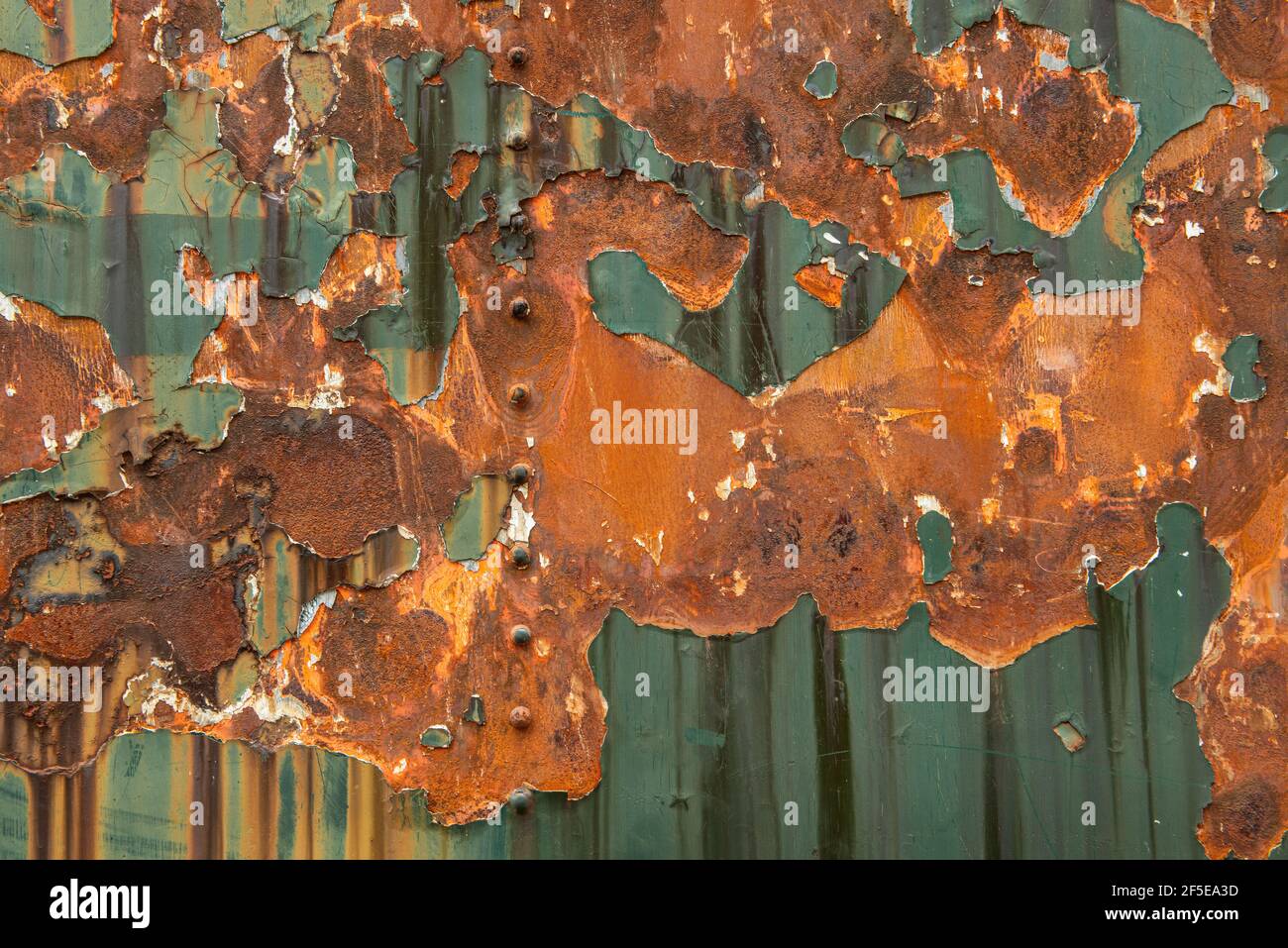 Rusted green iron surface of a old train in a beautiful rough ...