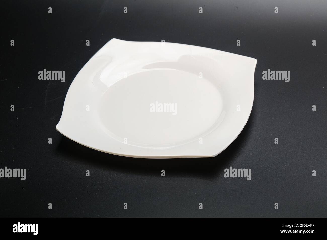 White empty plate for serving isolated Stock Photo - Alamy