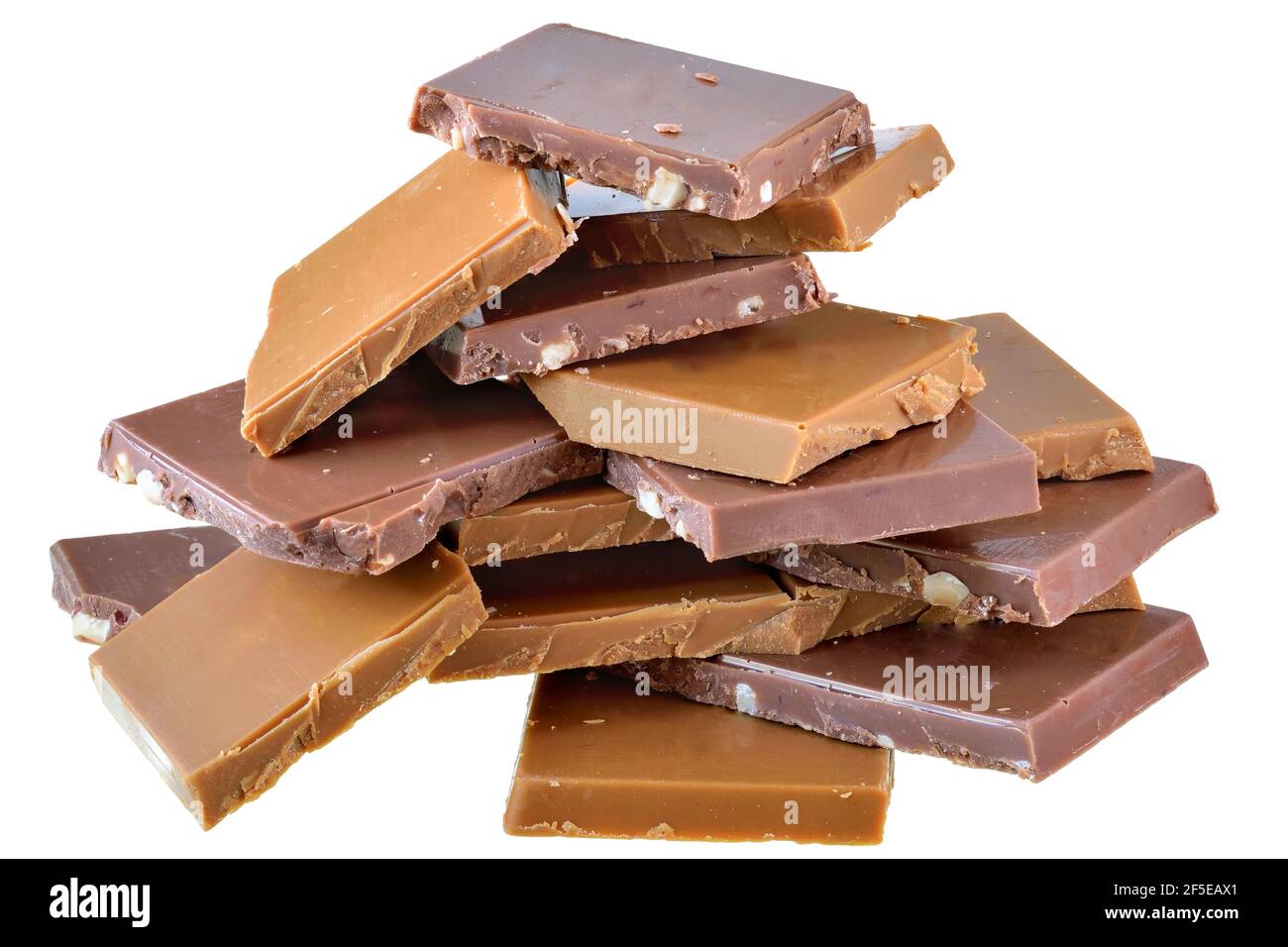 Heap cubes of chocolate with nuts close up isolated on white background ...