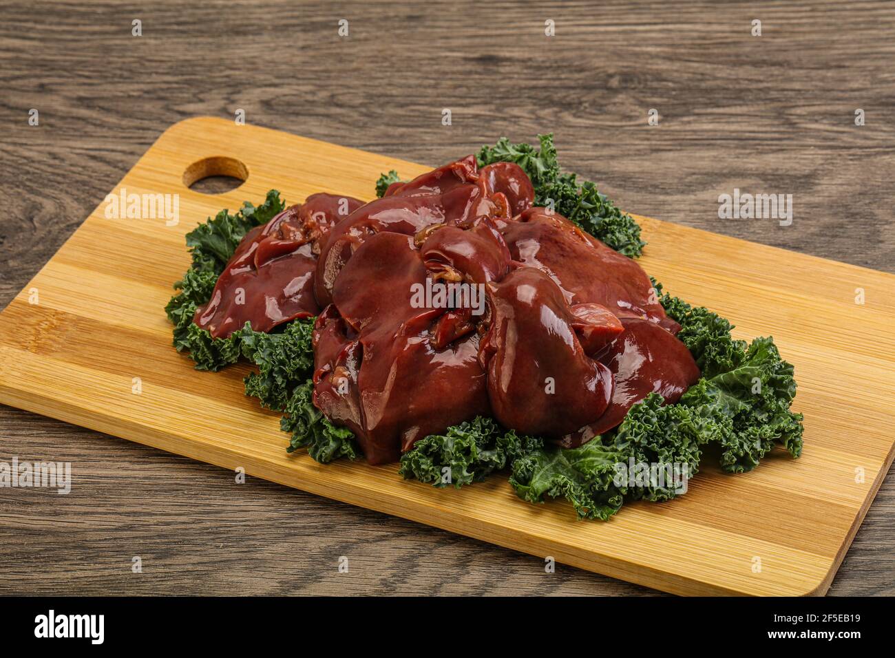 Raw chicken liver over board for cooking Stock Photo - Alamy