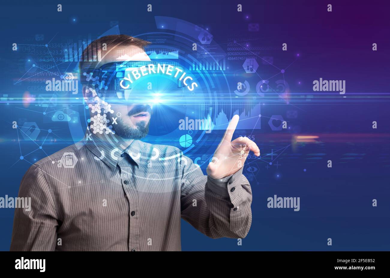 Businessman looking through VR glasses Stock Photo - Alamy
