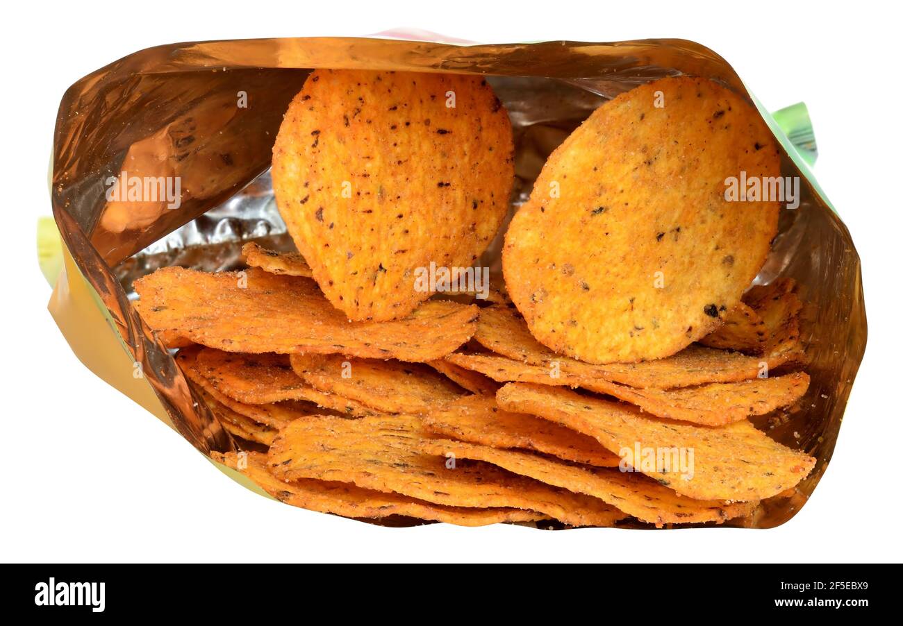 Pile of corn chips in packaging close up isolated on a white background ...
