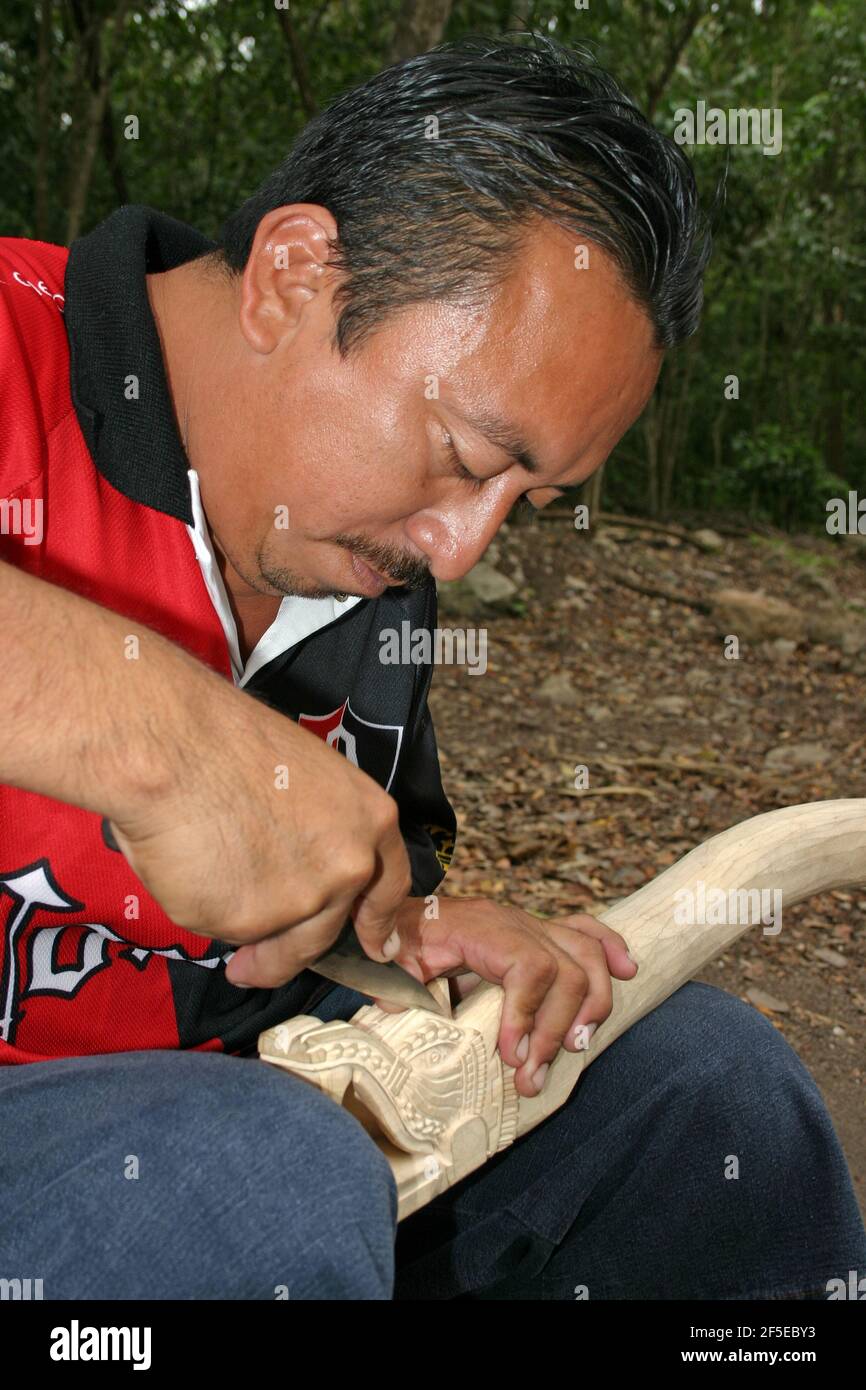 Wood carver artist at Chichen Itza Yucatan Mexico.A pre-Columbian city ...