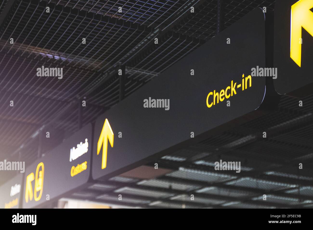 Airport informaction signs. Arrow on information screen to check-in ...