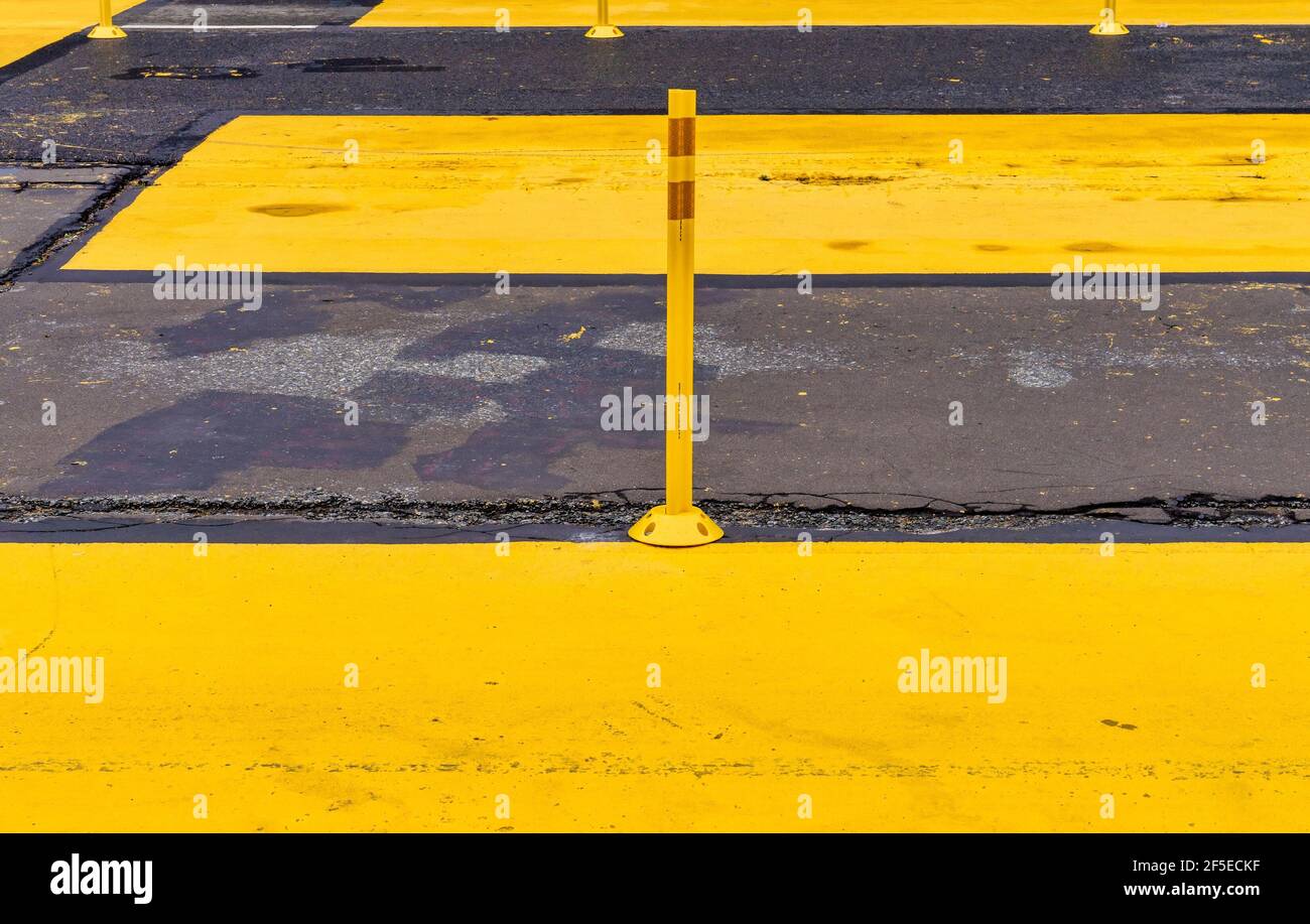 Bright yellow markings on a downtown street Stock Photo - Alamy