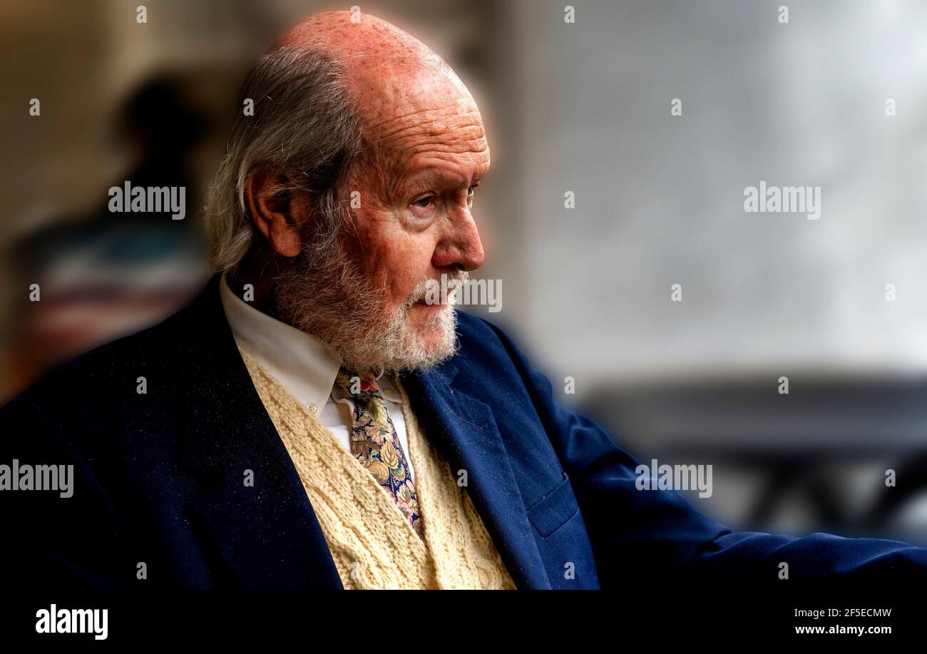 An elderly gentleman sitting alone at an outdoor cafe Stock Photo - Alamy