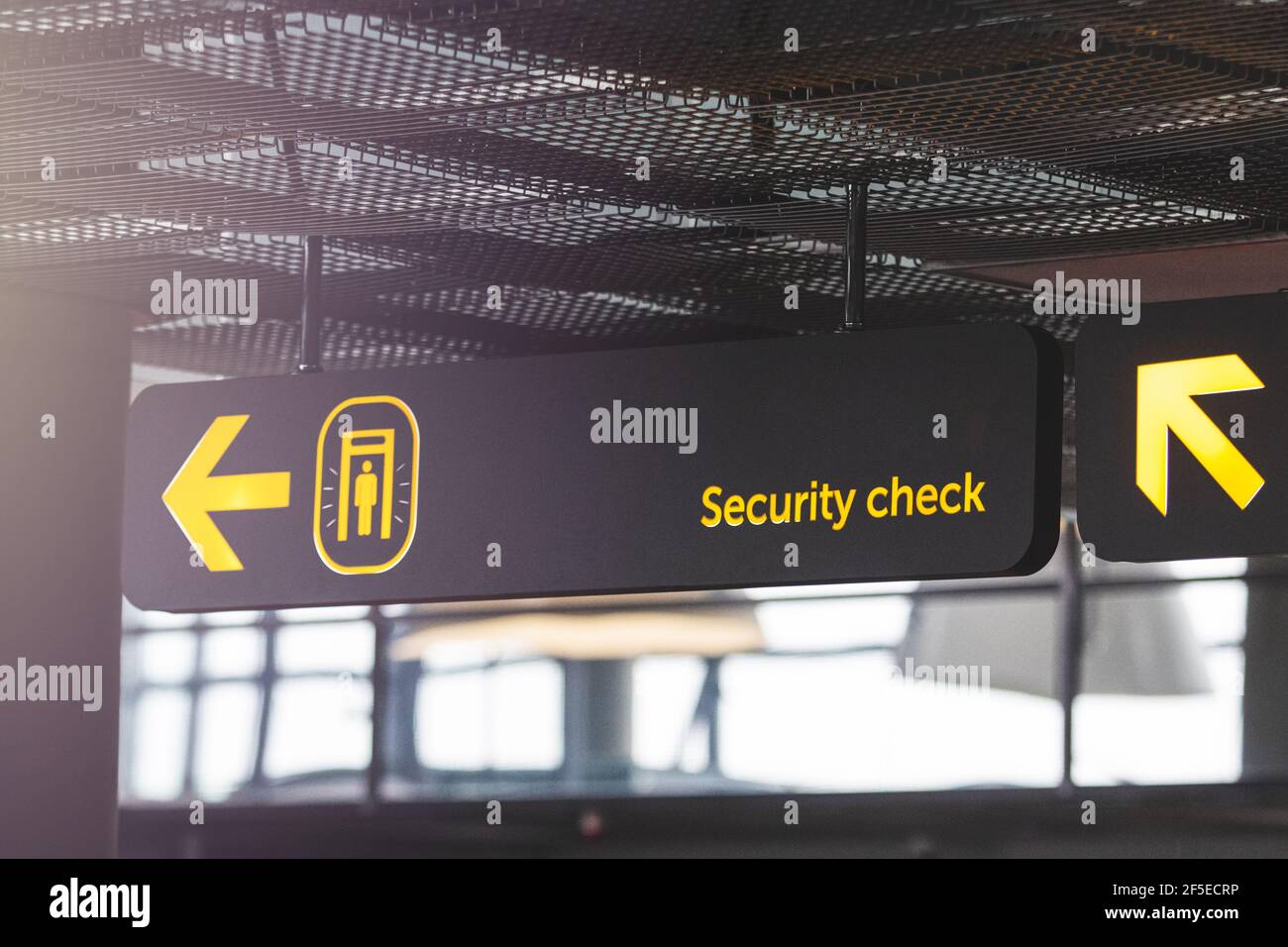 Airport informaction signs. Arrow on information screen leading to ...