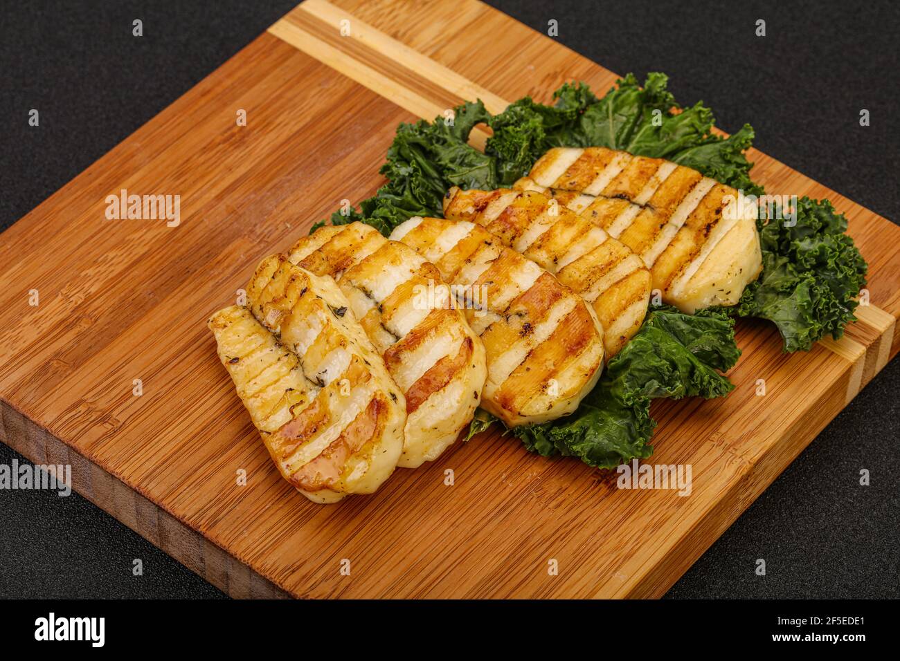 Grilled Greek haloumi cheese with herbs and spices Stock Photo - Alamy