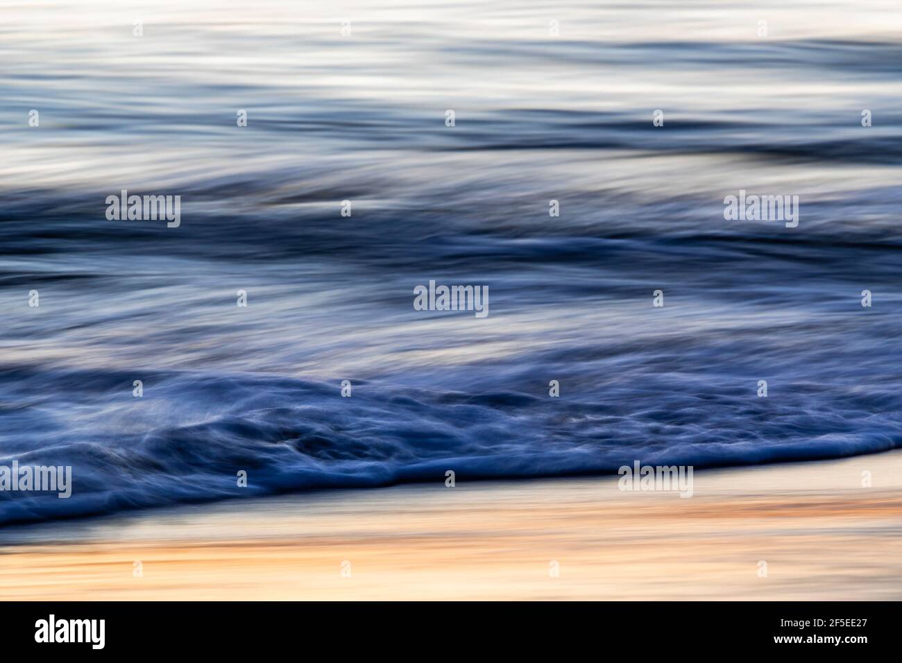 Vivid lights of the sea sunset with long exposure effect Stock Photo ...