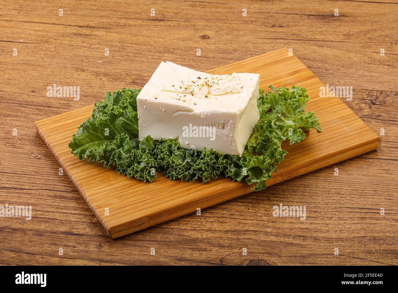 Traditional tasty Greek Feta soft cheese brick Stock Photo - Alamy