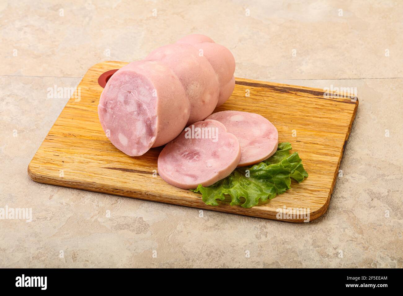Natural ham with two slices served salad leaves Stock Photo - Alamy