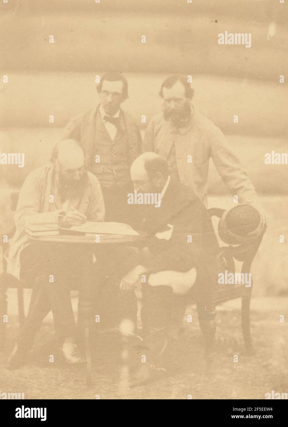 Group portrait of four men, India. Unknown maker Stock Photo - Alamy