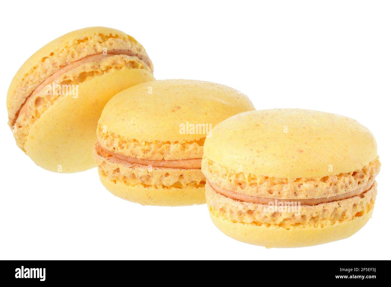 Yellow peach macaroon close up isolated on white background Stock Photo ...