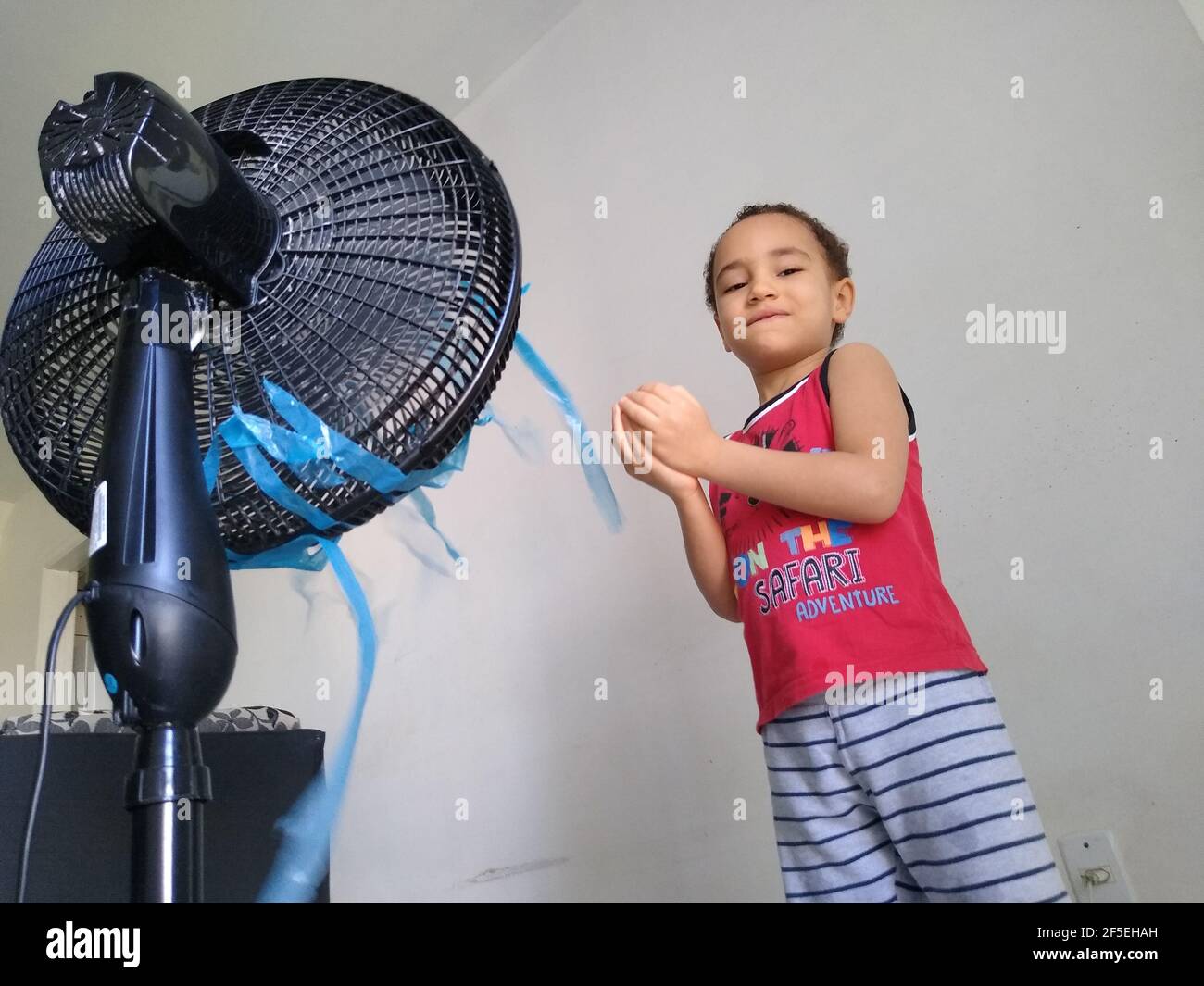 Ceiling fan kid hi-res stock photography and images - Alamy