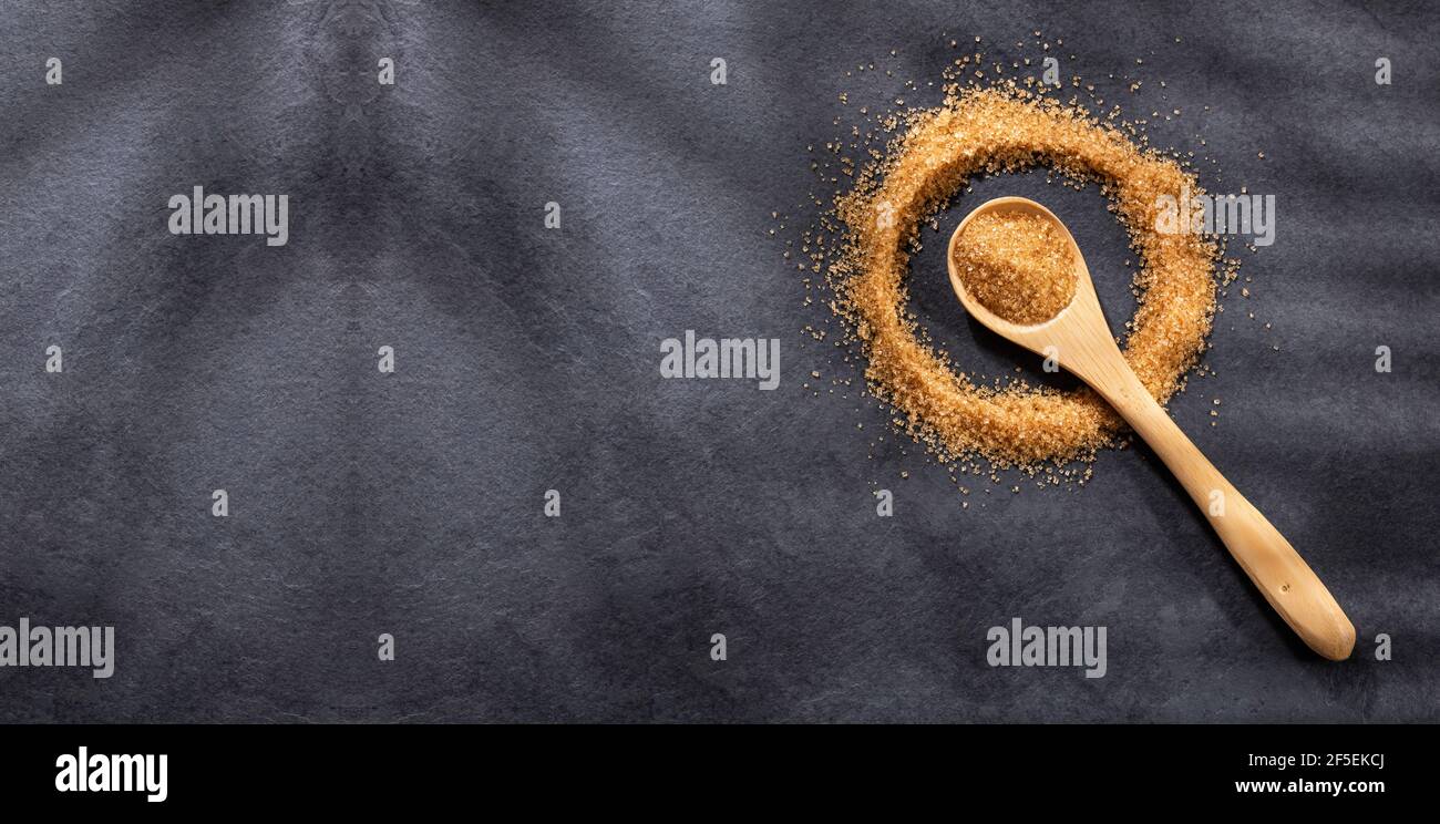 Brown sugar, granulated sucrose obtained from sugar cane Stock Photo ...