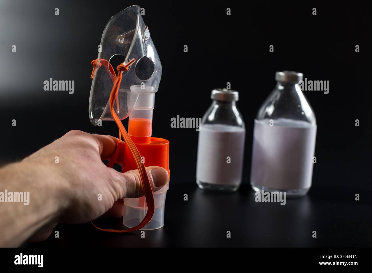 Hand holding mask for inhalation from neb ulizer and medical glass ...