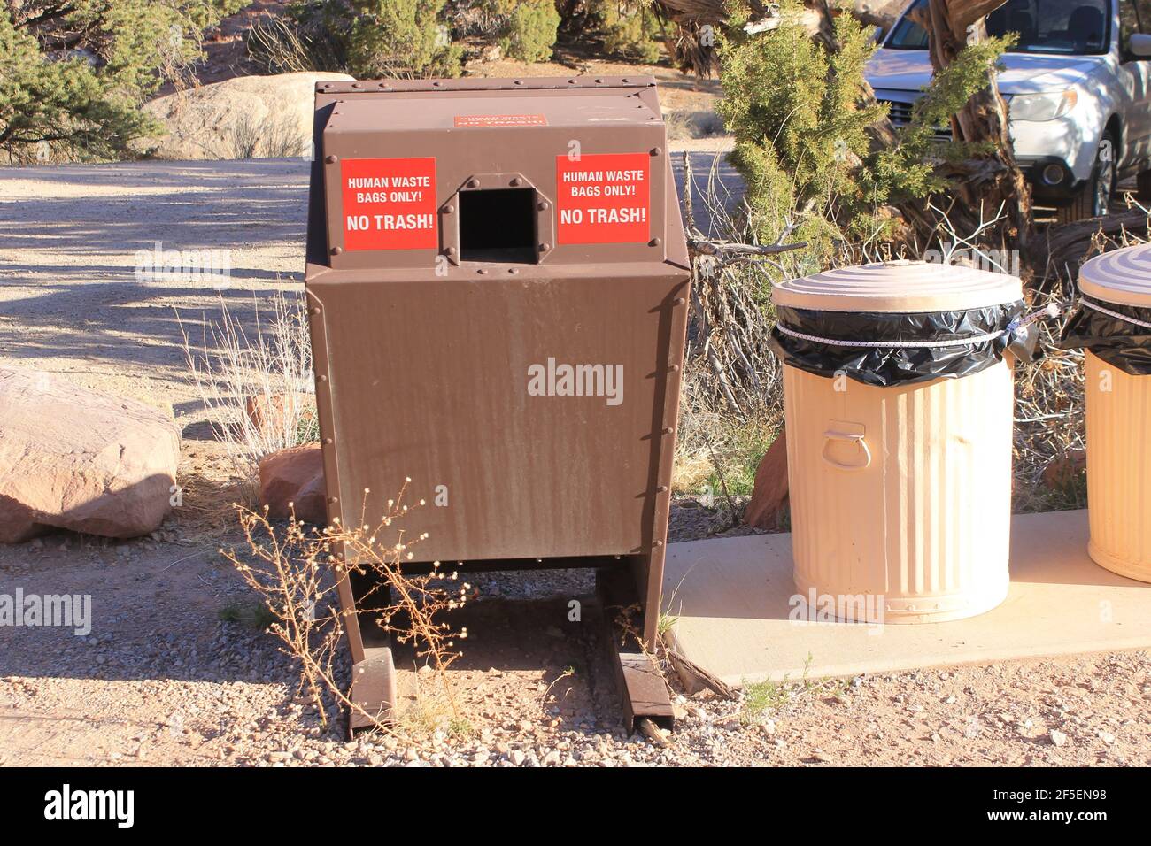 Human waste trash container in the desert Stock Photo - Alamy