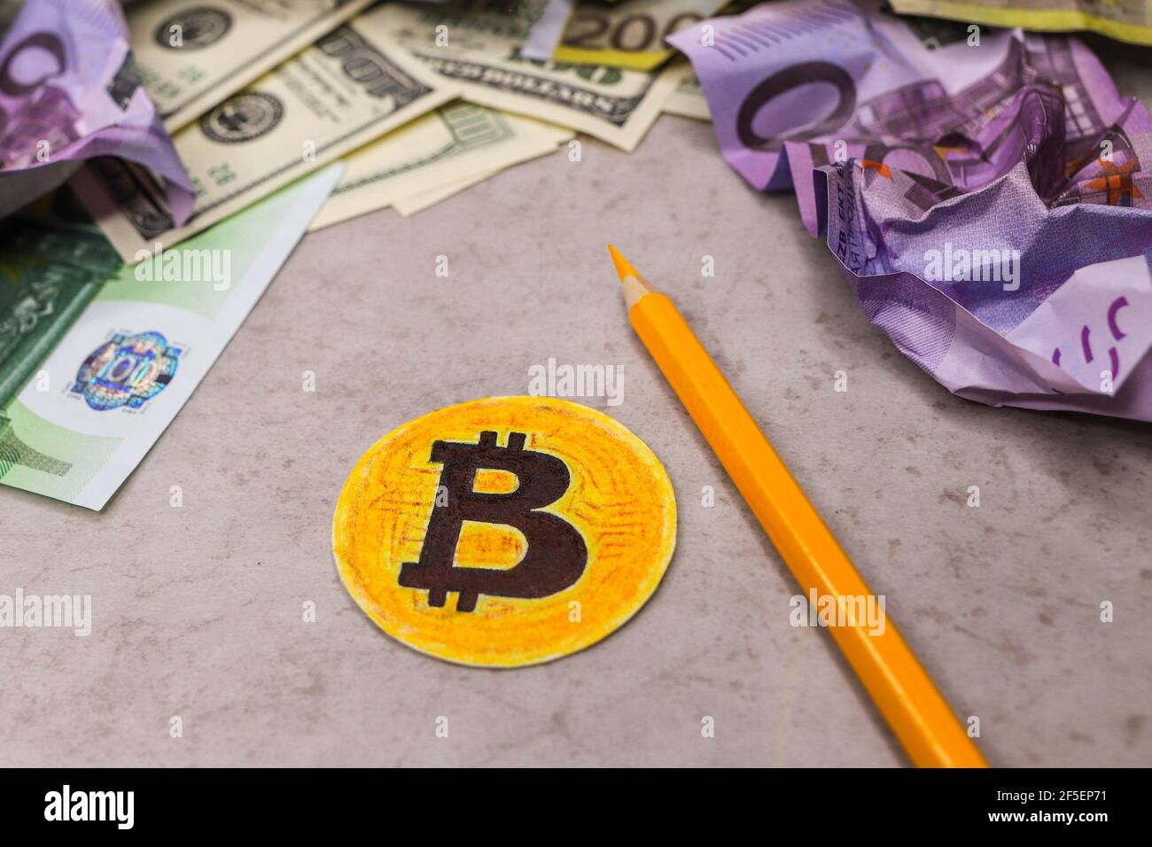 Paper coin with image of bitcoin on gray background. Crumpled cash ...