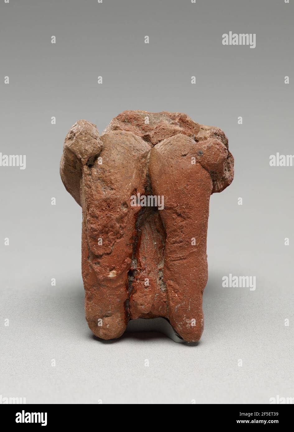 Fragmentary Neolithic seated male figurine. Unknown Stock Photo - Alamy