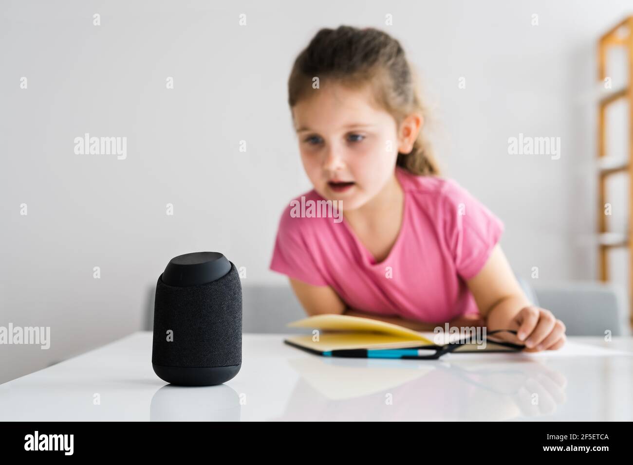 Child Kid Using Smart Speaker And Voice Assistant Stock Photo - Alamy
