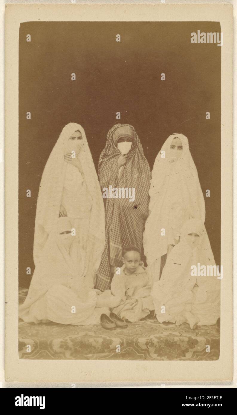 Three Algerian women wearing veils standing, with a little unveiled ...