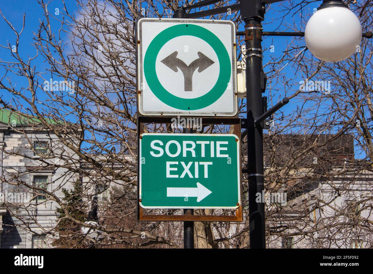 Left or right turn, bilingual exit traffic signs Stock Photo - Alamy