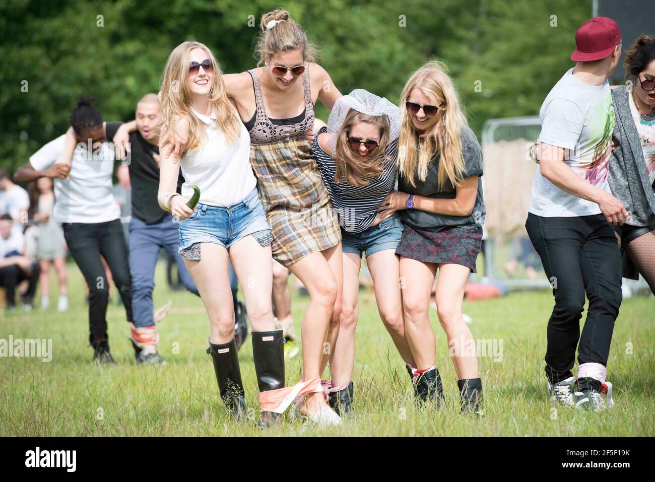 Festival goers competeing in the 5 legged race on day one of Field Day ...
