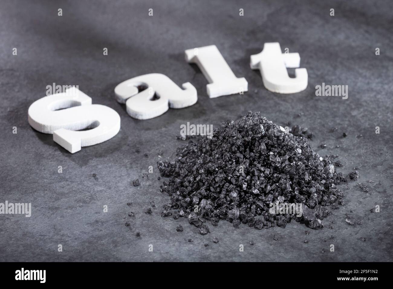 Hawaii black origin salt - Text space Stock Photo - Alamy