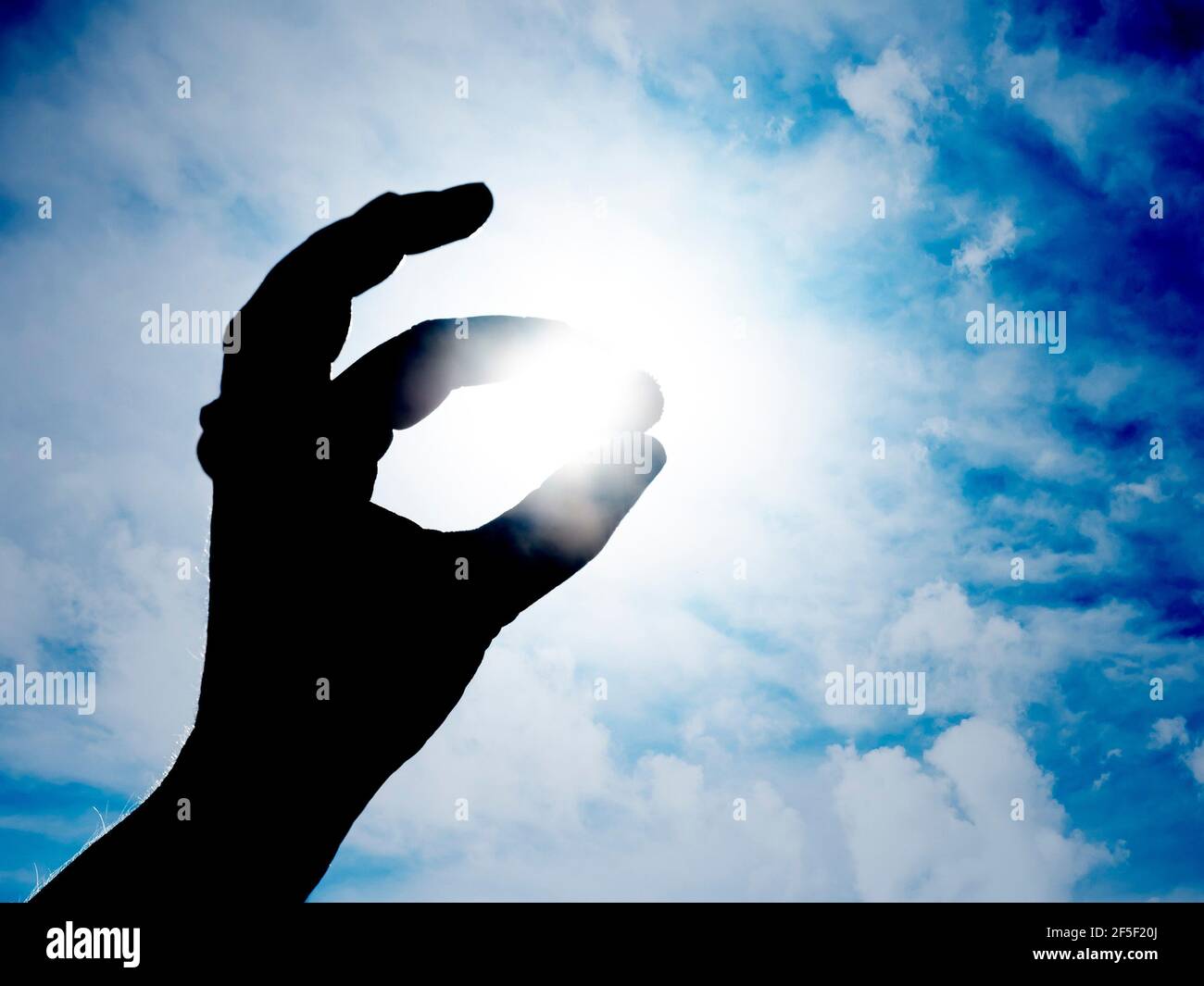 hand fingers catching the sun Stock Photo - Alamy