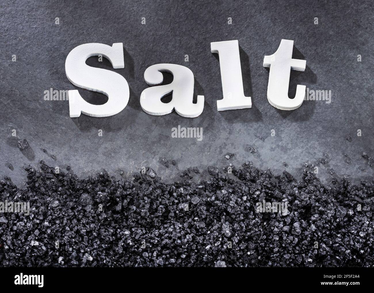 Hawaii black origin salt - Text space Stock Photo - Alamy
