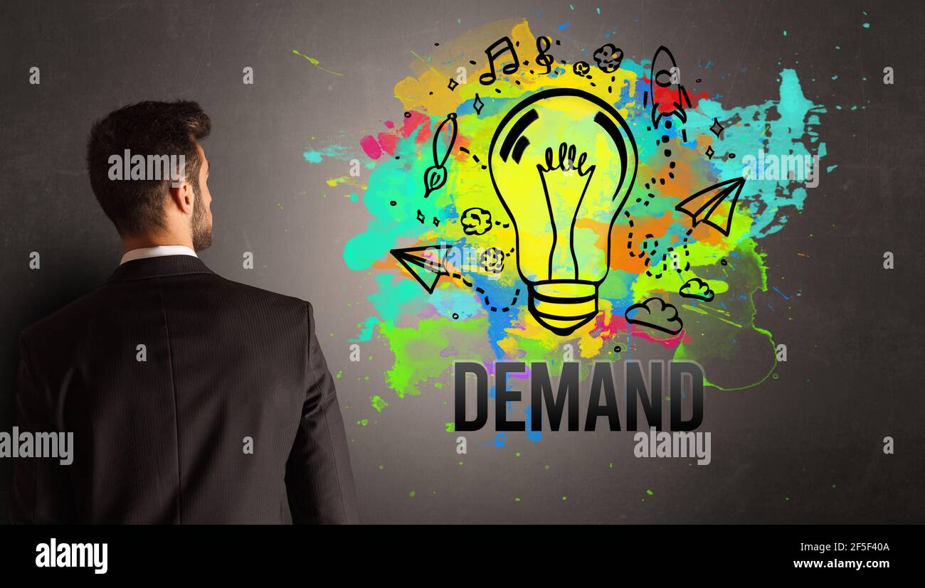 businessman drawing colorful light bulb Stock Photo - Alamy