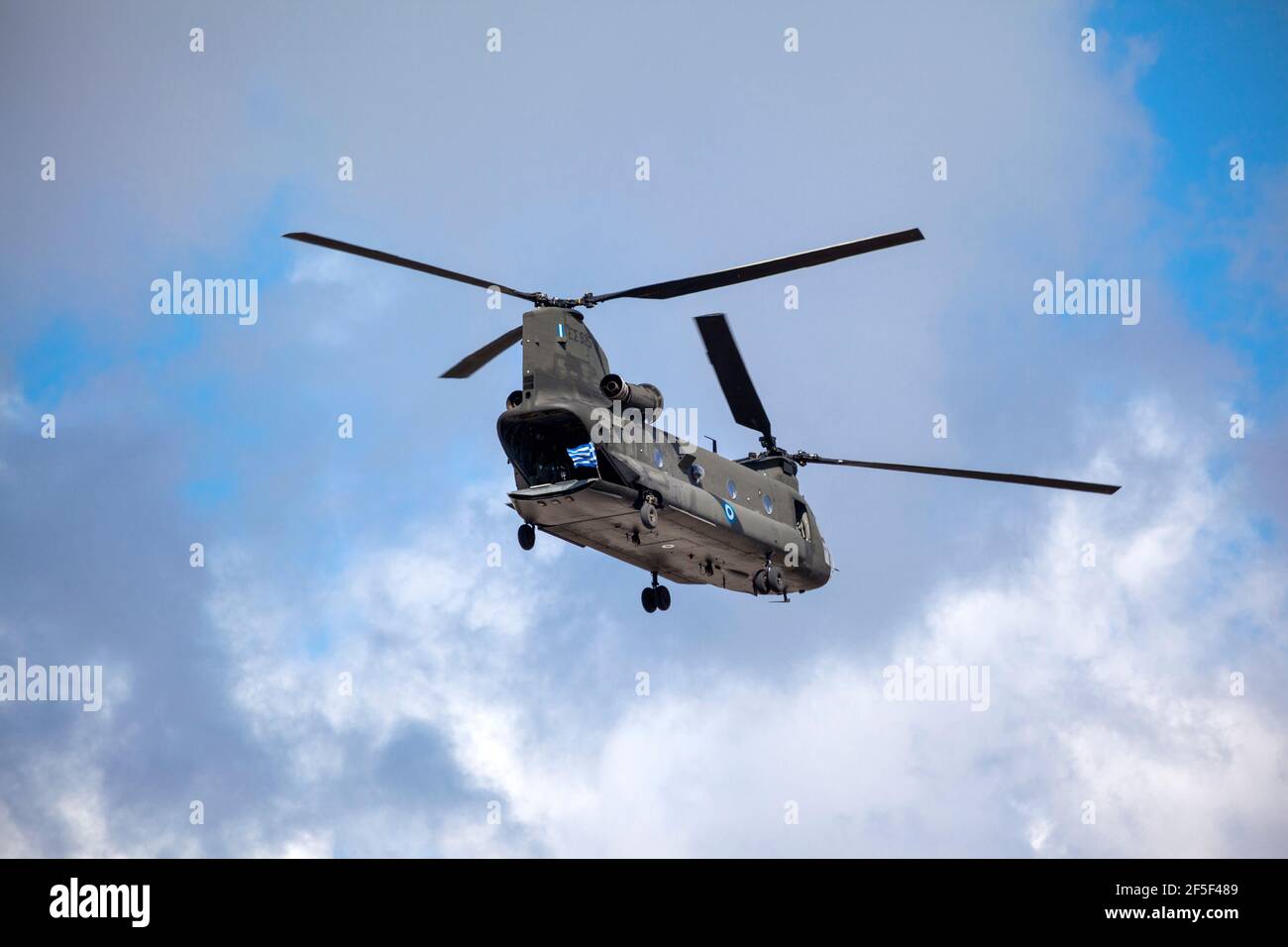 A Boeing CH-47 Chinook helicopter flying above Athens, Greece, during ...