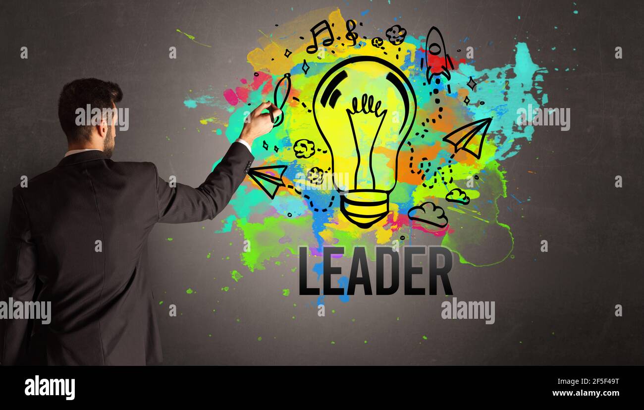 businessman drawing colorful light bulb Stock Photo - Alamy