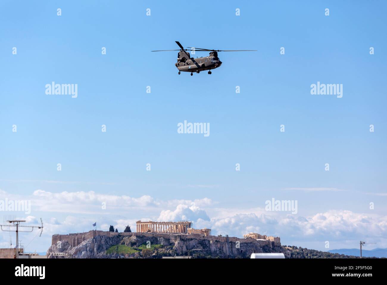 Boeing CH-47 Chinook helicopter flying above Akropolis, Athens, during ...