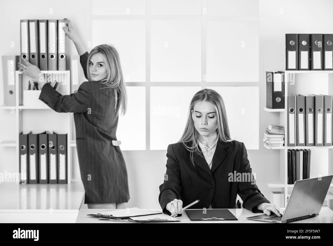 Woman thinking laptop documents Black and White Stock Photos & Images ...