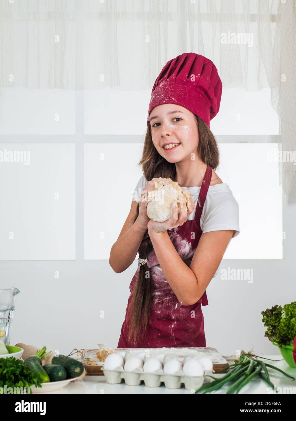 kid chef cooking making dough. child prepare healthy food at home and ...