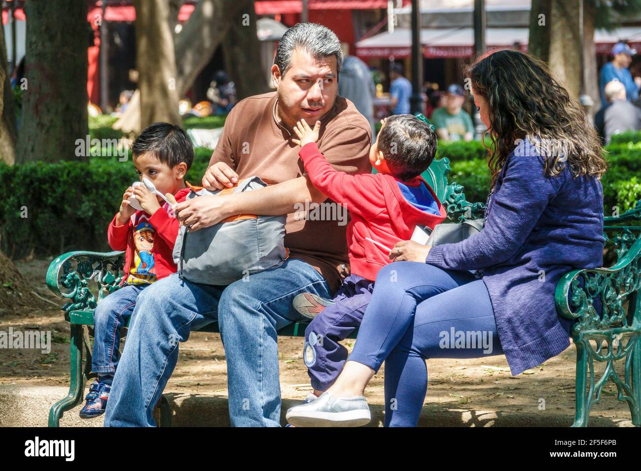 Mexican woman sitting on bench hi-res stock photography and images - Alamy