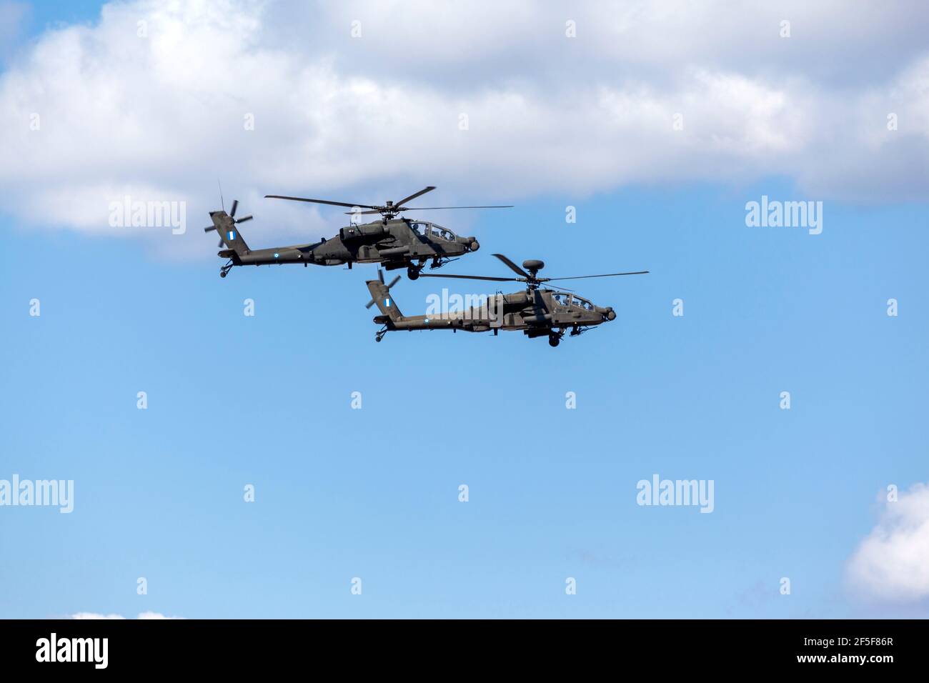 ΑΗ-64 Apache helicopters flying in formation in the sky of Athens ...