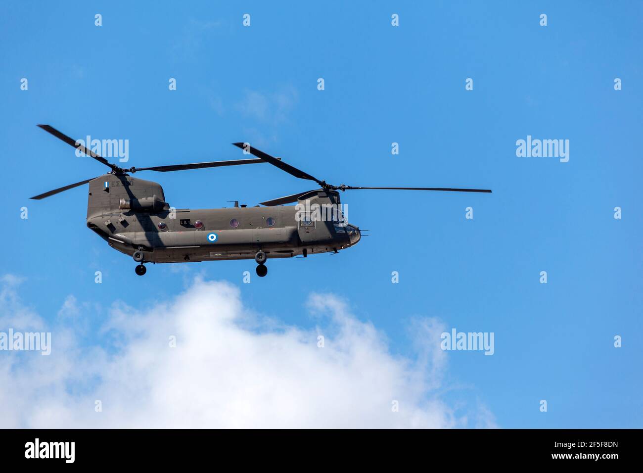 A Boeing CH-47 Chinook helicopter flying above Athens, Greece, during ...