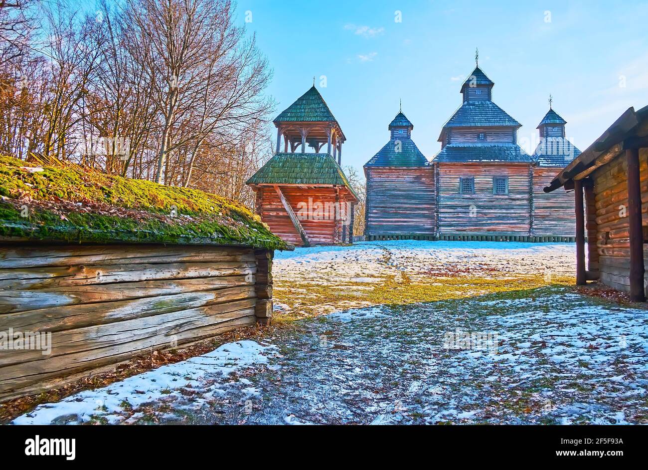 The old timber Church of the Resurrection and its belfry with old walls ...