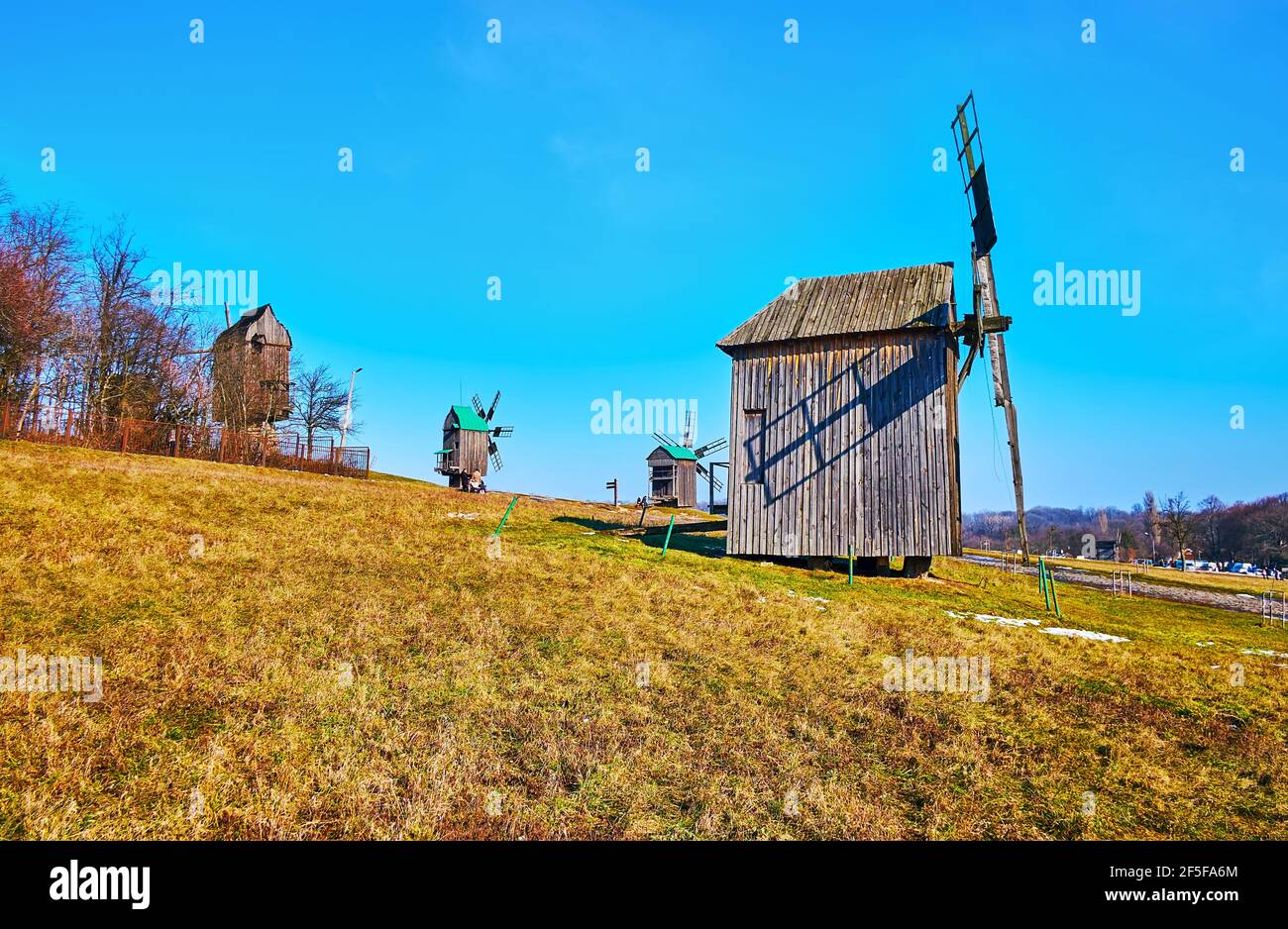 Traditional wooden windmills on the hill slope in Pyrohiv Skansen, Kyiv ...