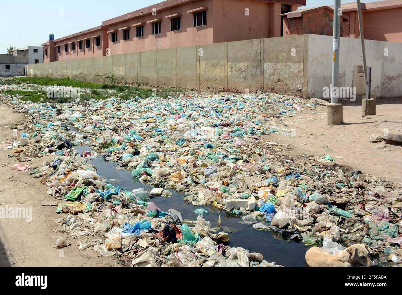 Pakistan. March 26, 2021: Huge heap of garbage and sewerage water ...