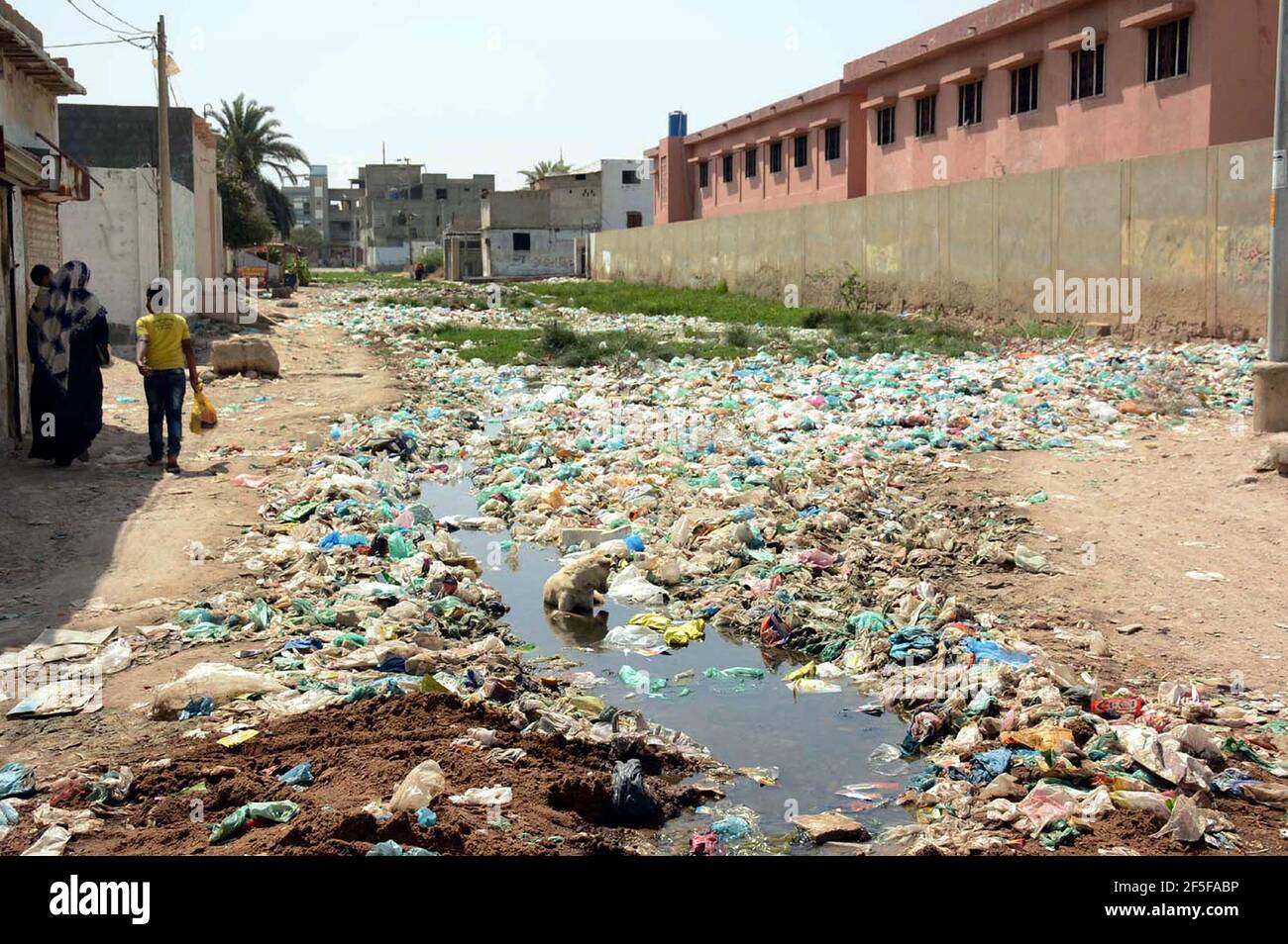 Pakistan. March 26, 2021: Huge heap of garbage and sewerage water ...